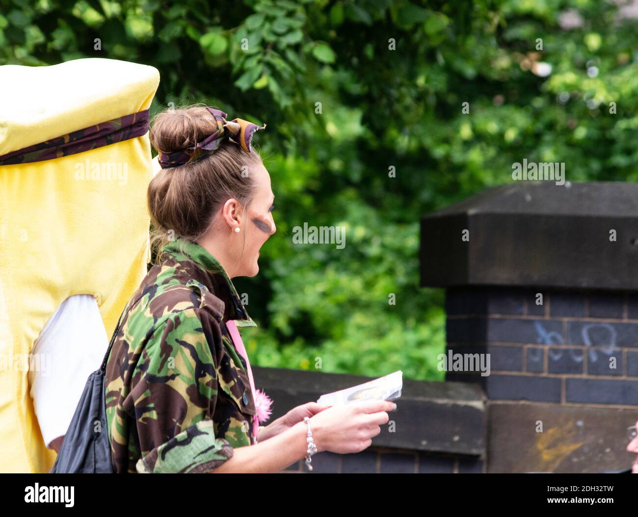 Young girl wearing an army jacket Stock Photo - Alamy