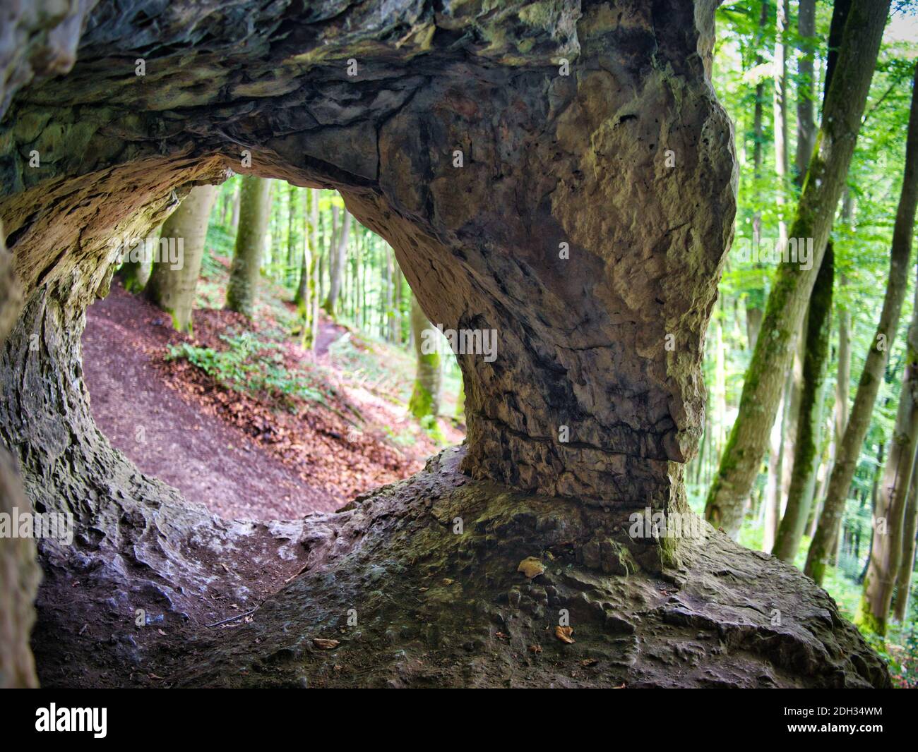 Whole in a rock Stock Photo - Alamy