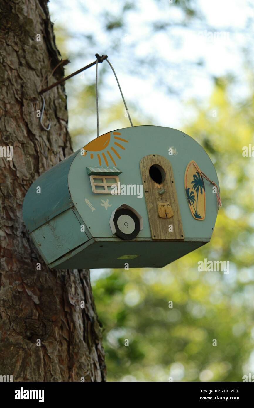 A vertical shot of a funny handmade birdhouse Stock Photo - Alamy