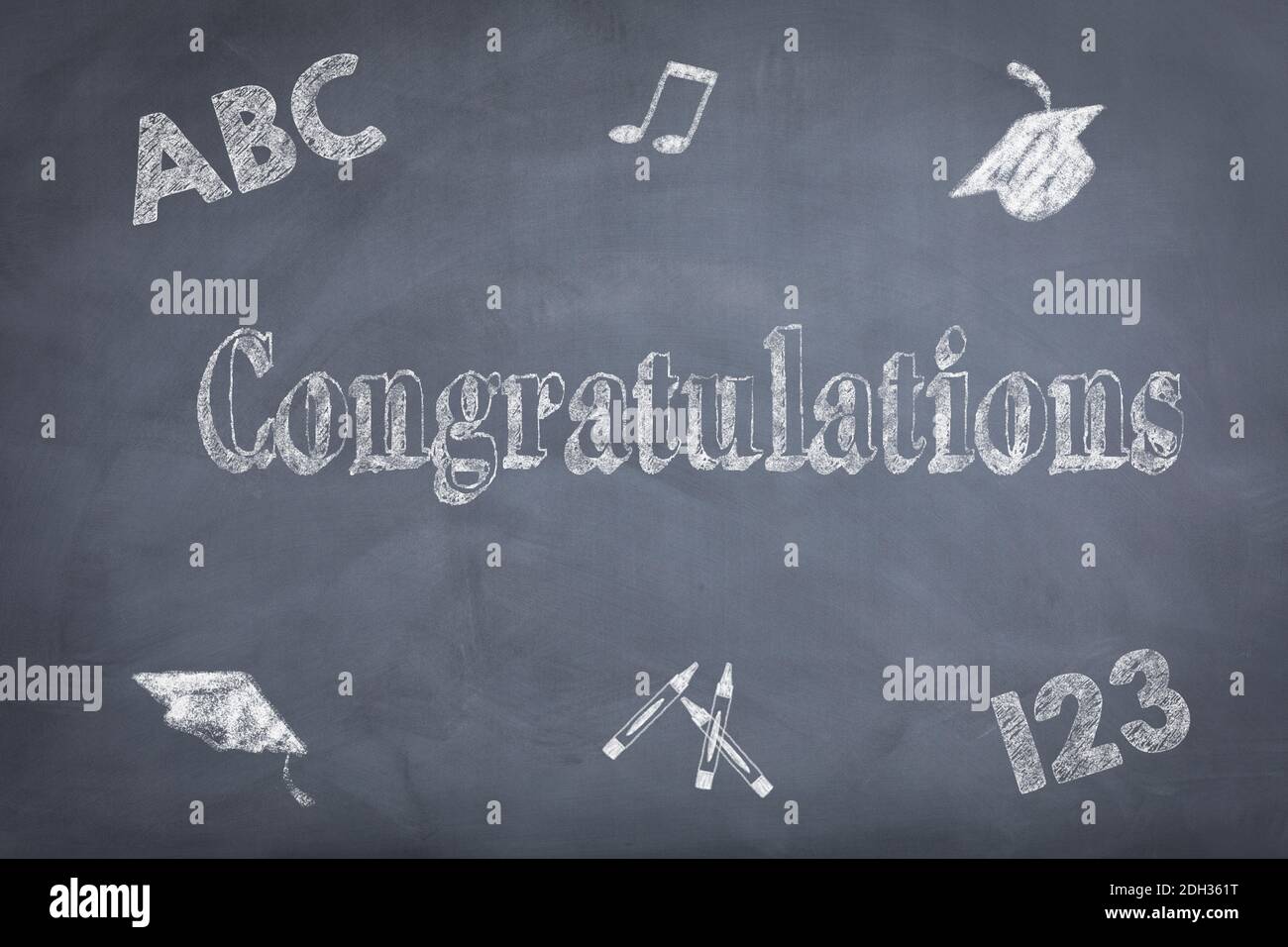 Celebration of achievement on a chalkboard with educational symbols and ...