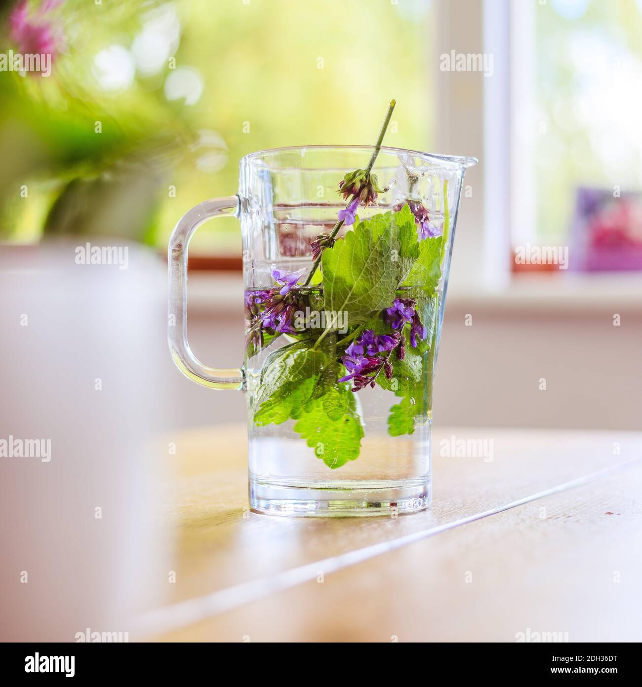 Cold refreshing water jar in summer: Tasty lemonade with herbs, multi ...