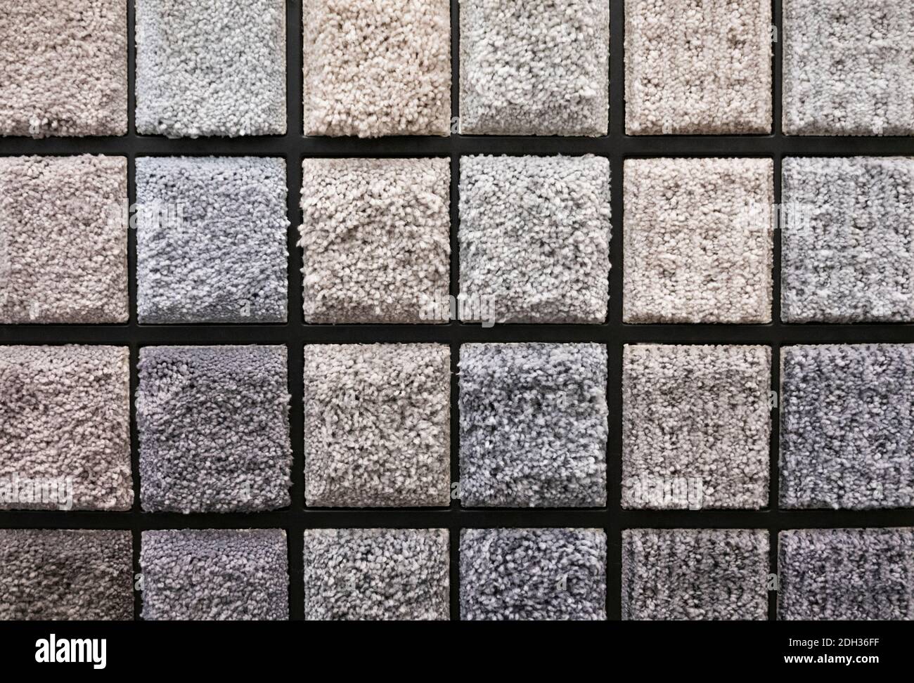 Variety of carpet texture samples displayed on a textured board ...