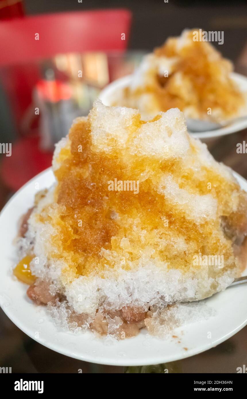 Eating shaved ice with colorful dessert Stock Photo - Alamy