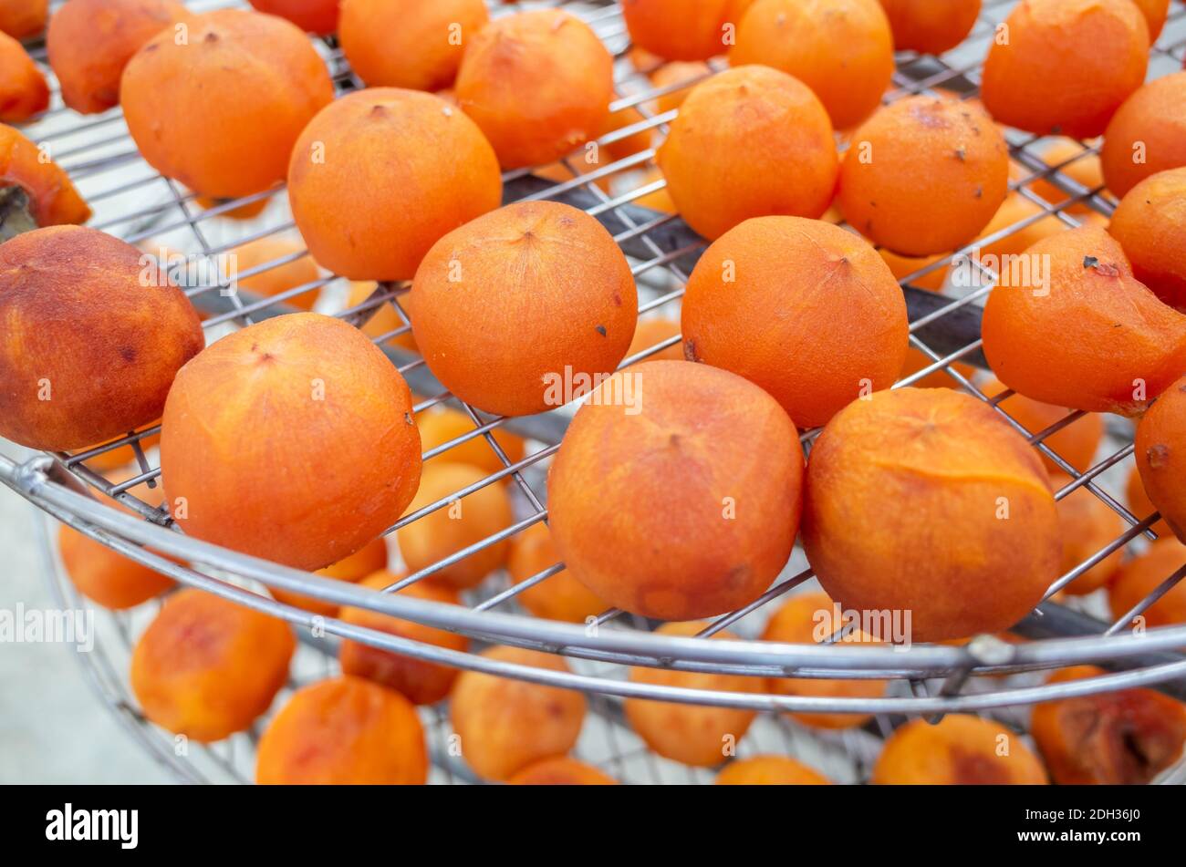 Dried up persimmon under the sun Stock Photo - Alamy