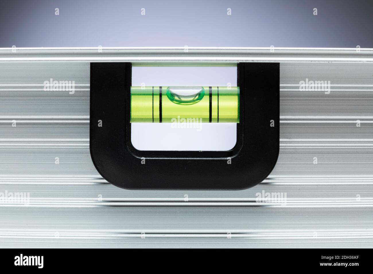 Level tool placed on a metal surface to ensure accurate alignment for ...