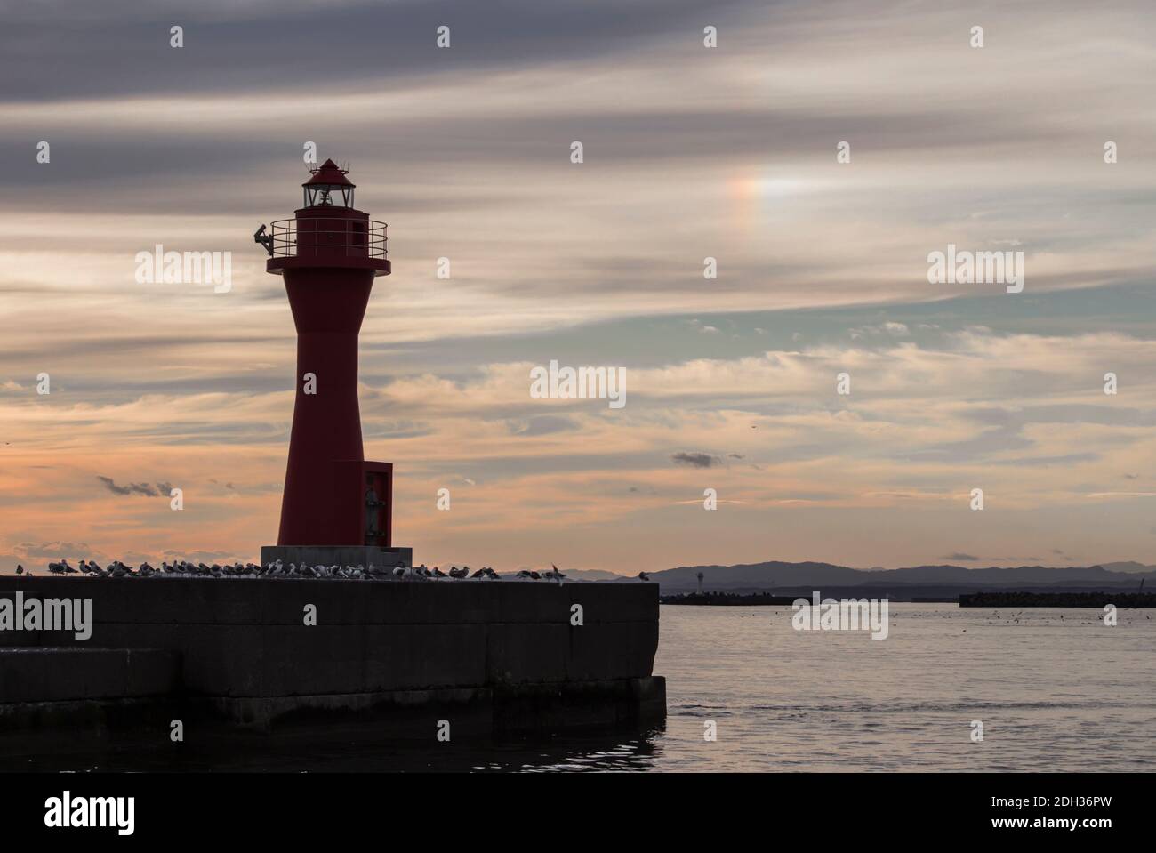 The dim sky at dusk and the lighthouse at Kushiro Port Stock Photo - Alamy