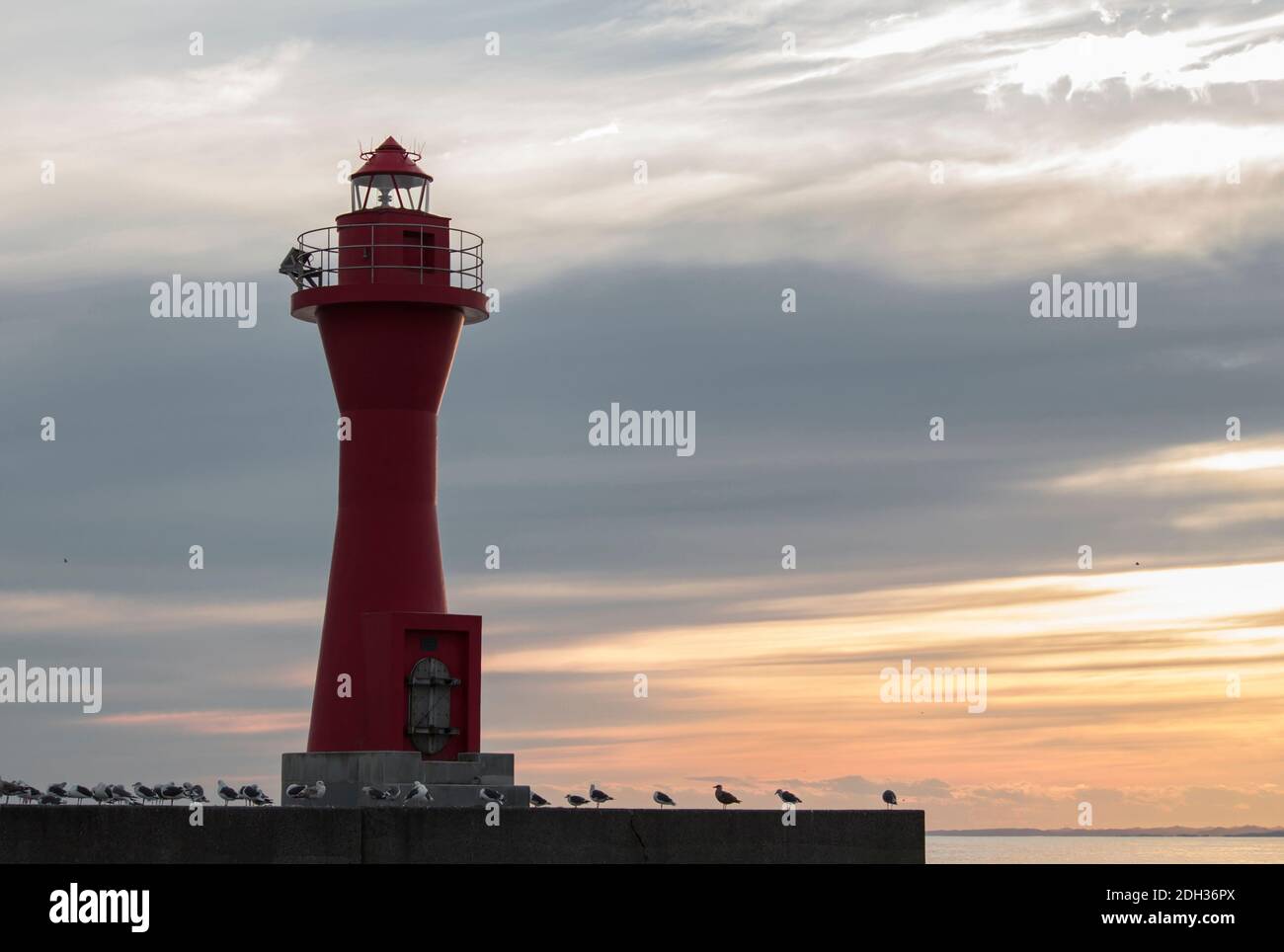 The dim sky at dusk and the lighthouse at Kushiro Port Stock Photo - Alamy