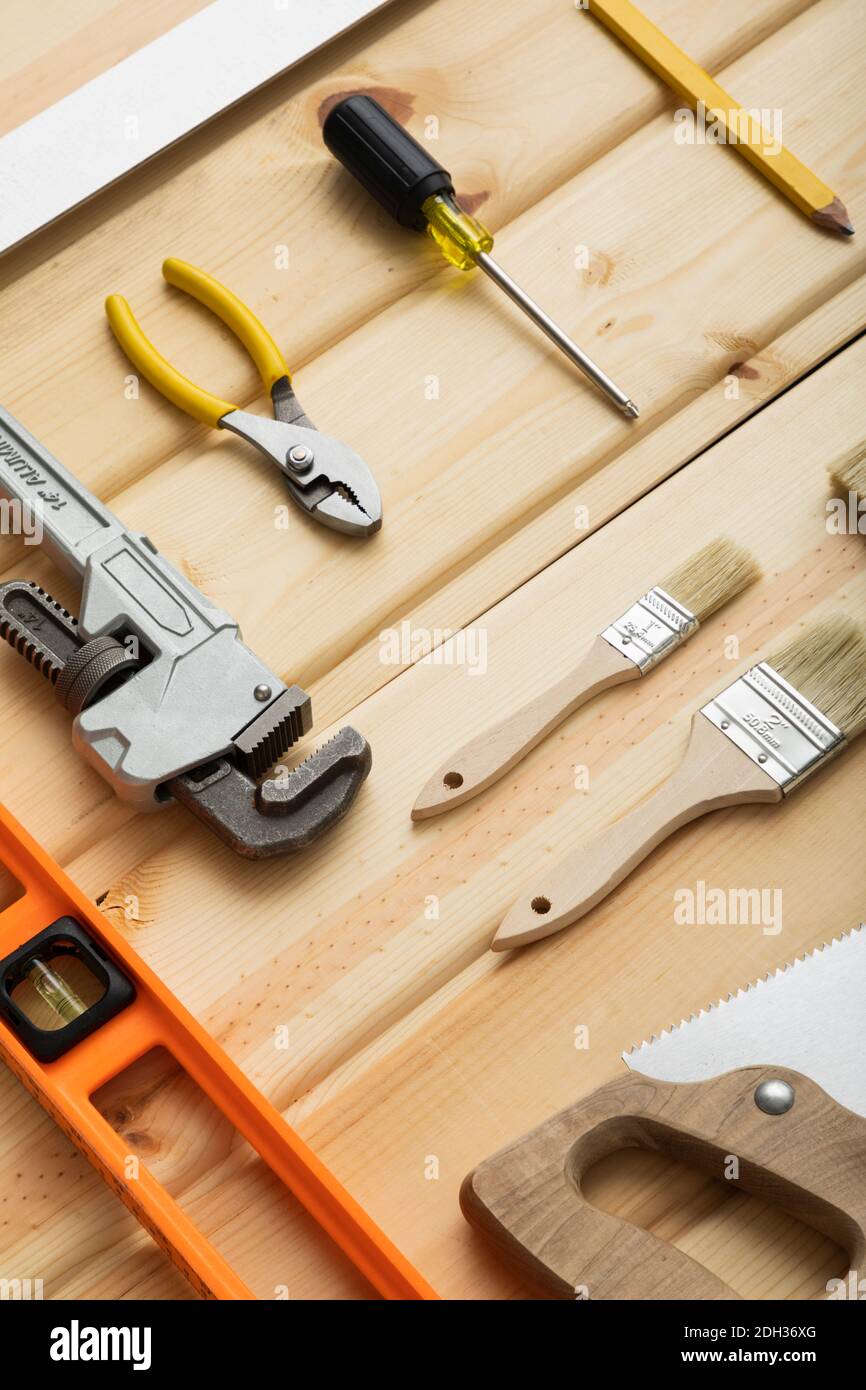 Tools and equipment displayed on a wooden surface ready for a home ...