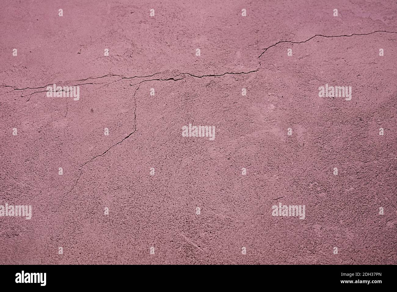 Rough ground with some cracks, front view, sand, light Stock Photo - Alamy