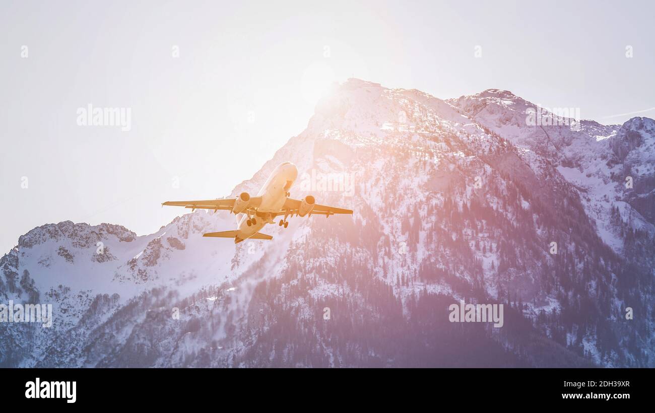 Airplane scenery: take off from airport, mountain range in the alps ...