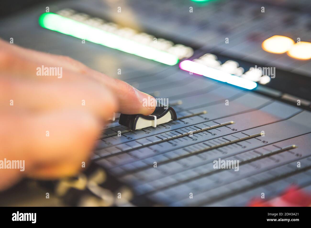 Sound recording studio mixer desk: sound engineer is operating a ...