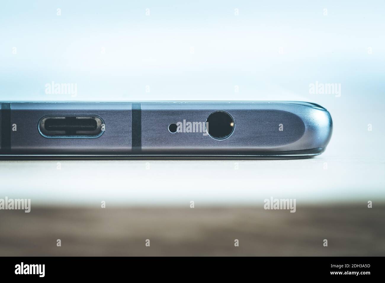 Plugs of a modern smartphone. Headphone jack and usb type c Stock Photo ...