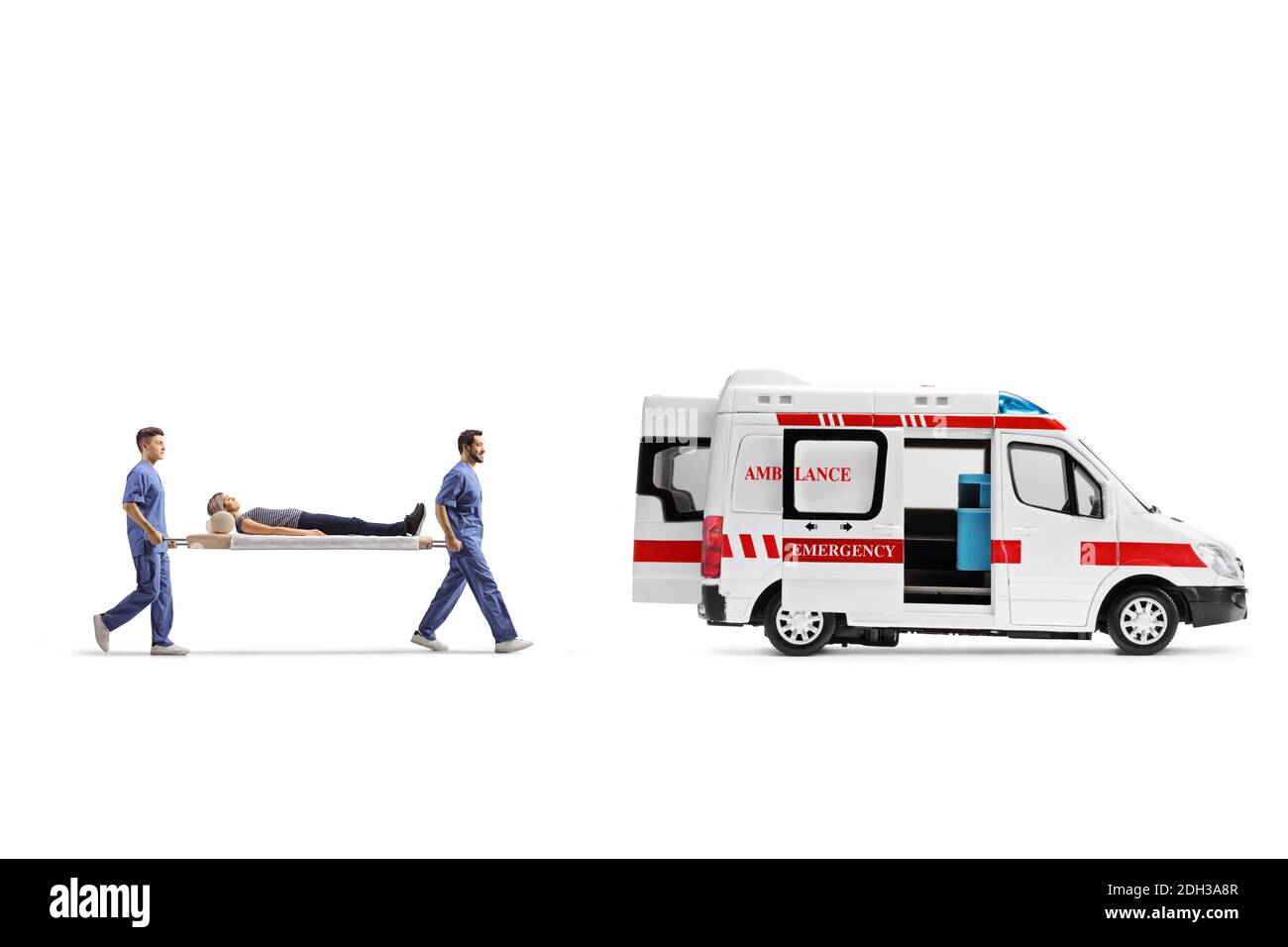 Full length profile shot of medical workers carrying a stretcher with a ...