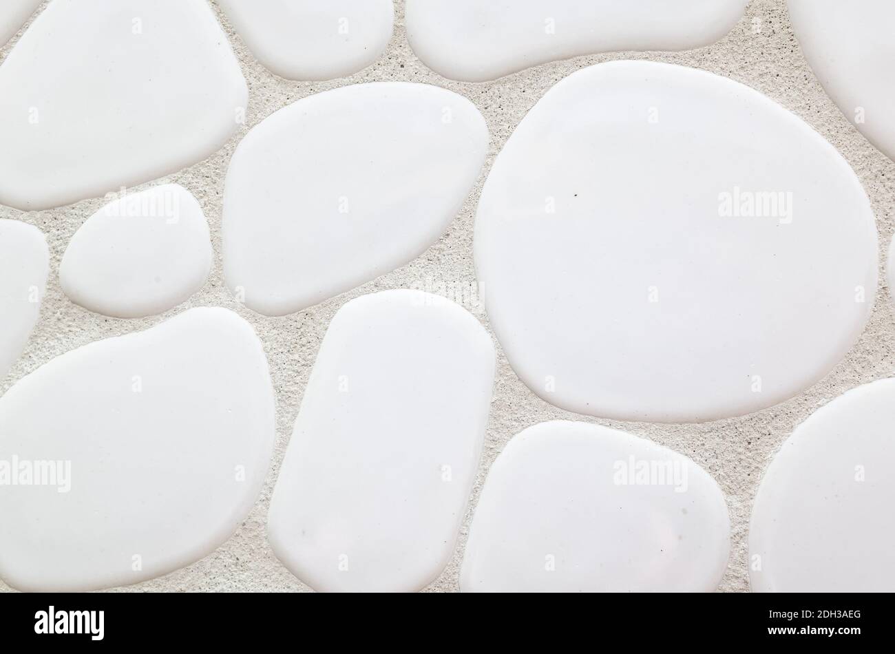 Wall of oval and round stone Stock Photo - Alamy