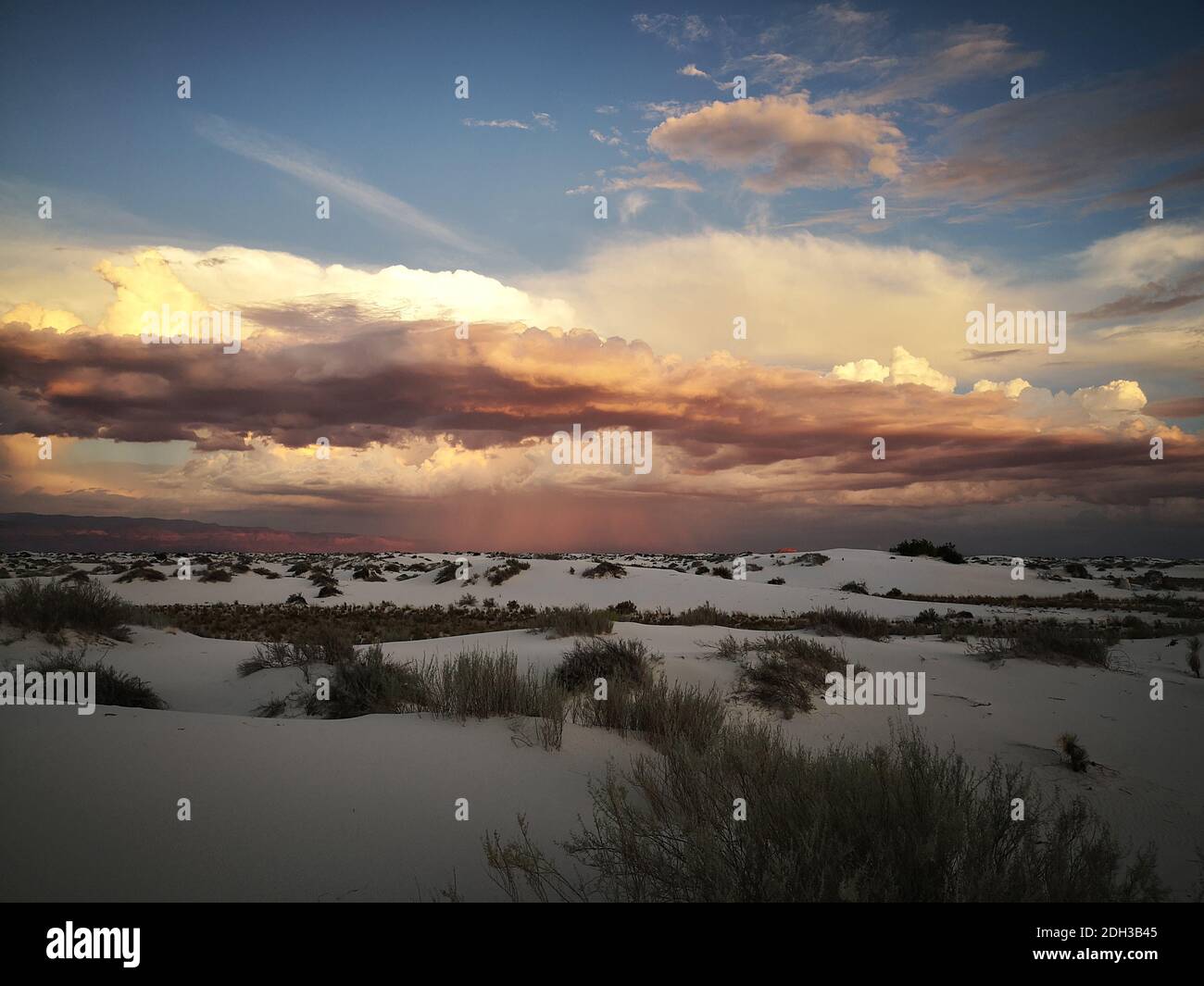 Dark clouds over the desert Stock Photo - Alamy