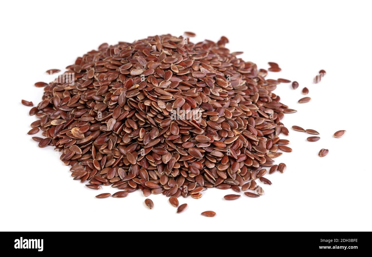 Pile of flax seeds on a white background Stock Photo - Alamy