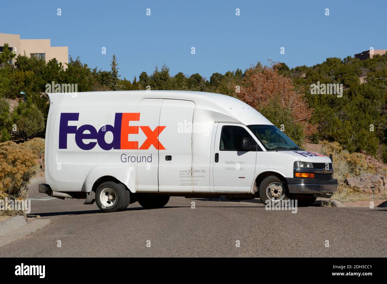 A FedEx (Federal Express) van makes package deliveries in Santa Fe, New ...