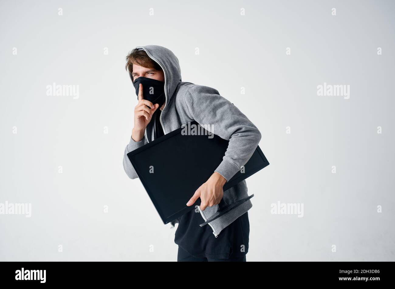 machine hacker hooded head stealth theft technician Stock Photo - Alamy