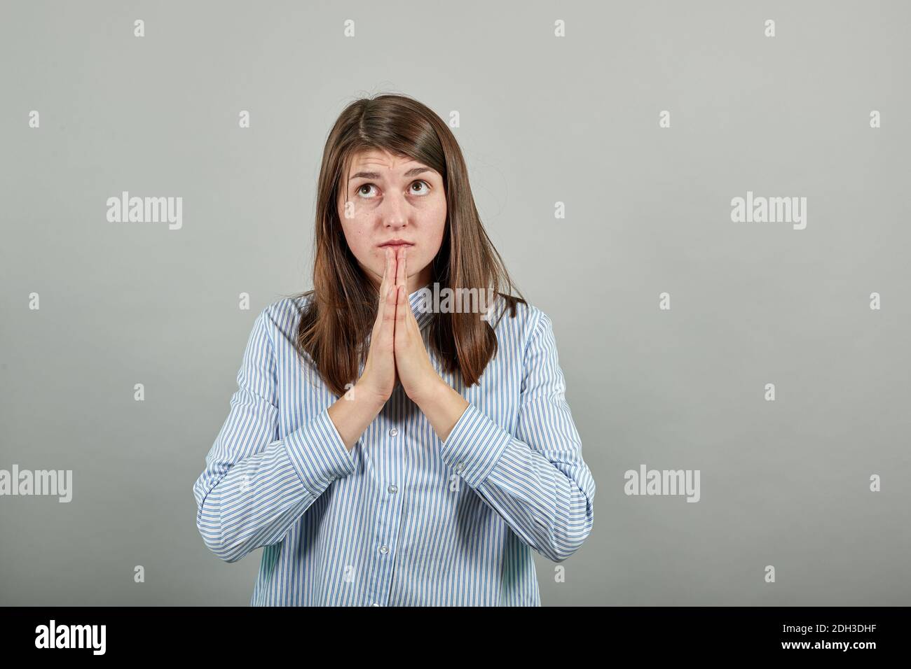 Folded hands together praying asking God for help ask implore wish ...