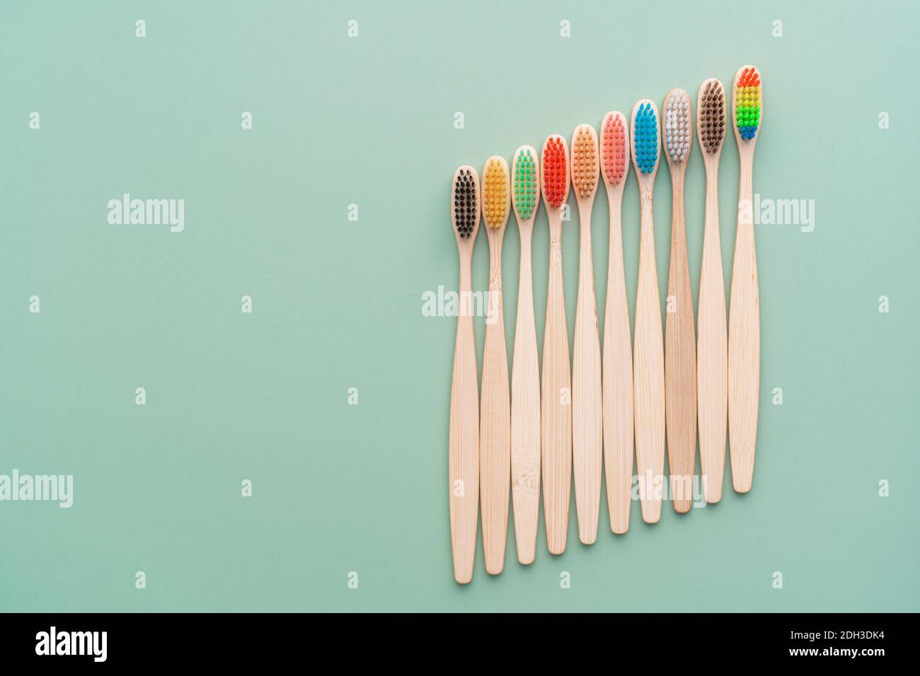 A set of Eco-friendly antibacterial toothbrushes made of bamboo wood on ...