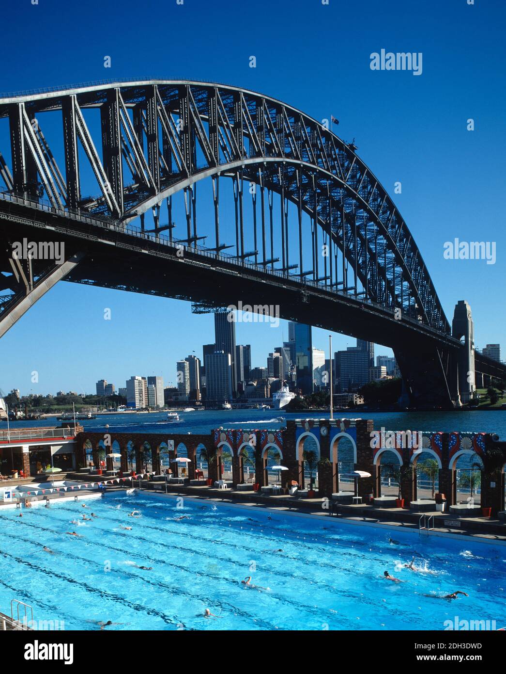 Australia, NSW, Sydney, Harbour Bridge with swimmers in Olympic ...