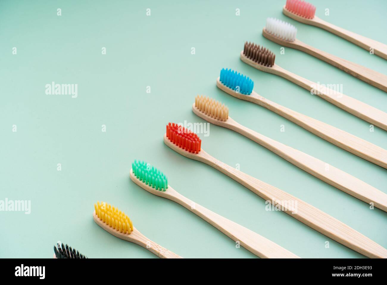 A set of Eco-friendly antibacterial toothbrushes made of bamboo wood on ...