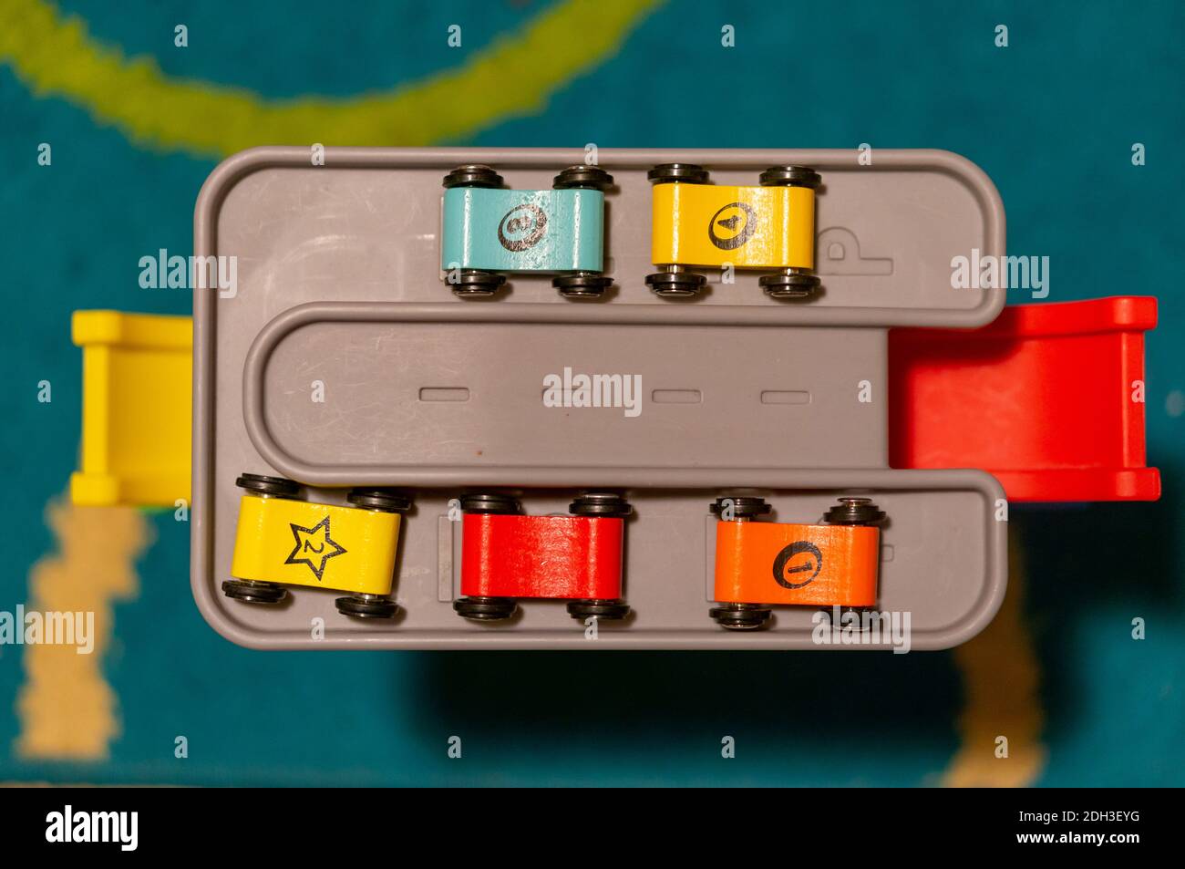 Wooden wheeled toy vehicles on the top of a garage Stock Photo - Alamy