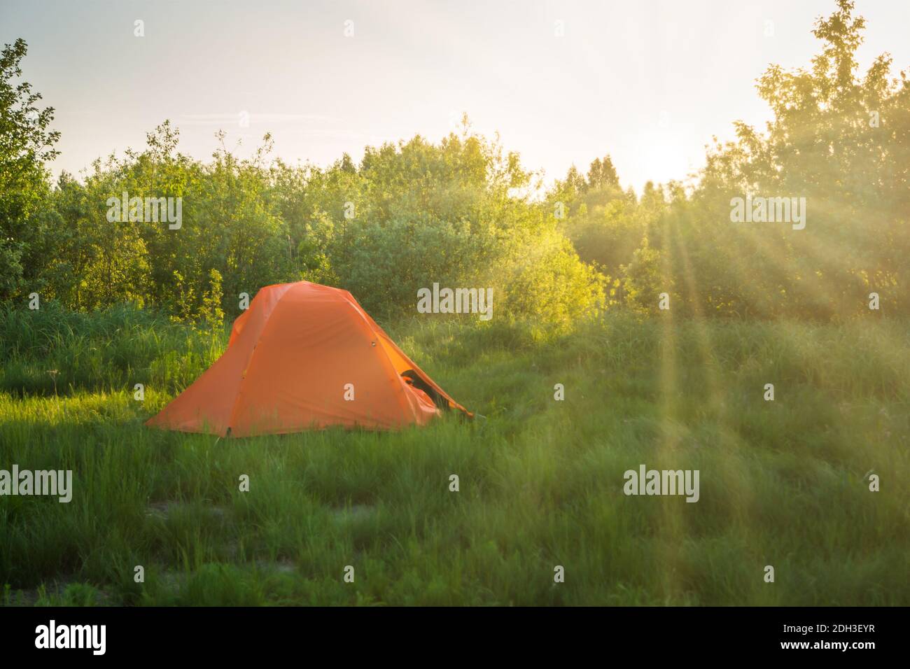 Tent camping at sunset Stock Photo - Alamy