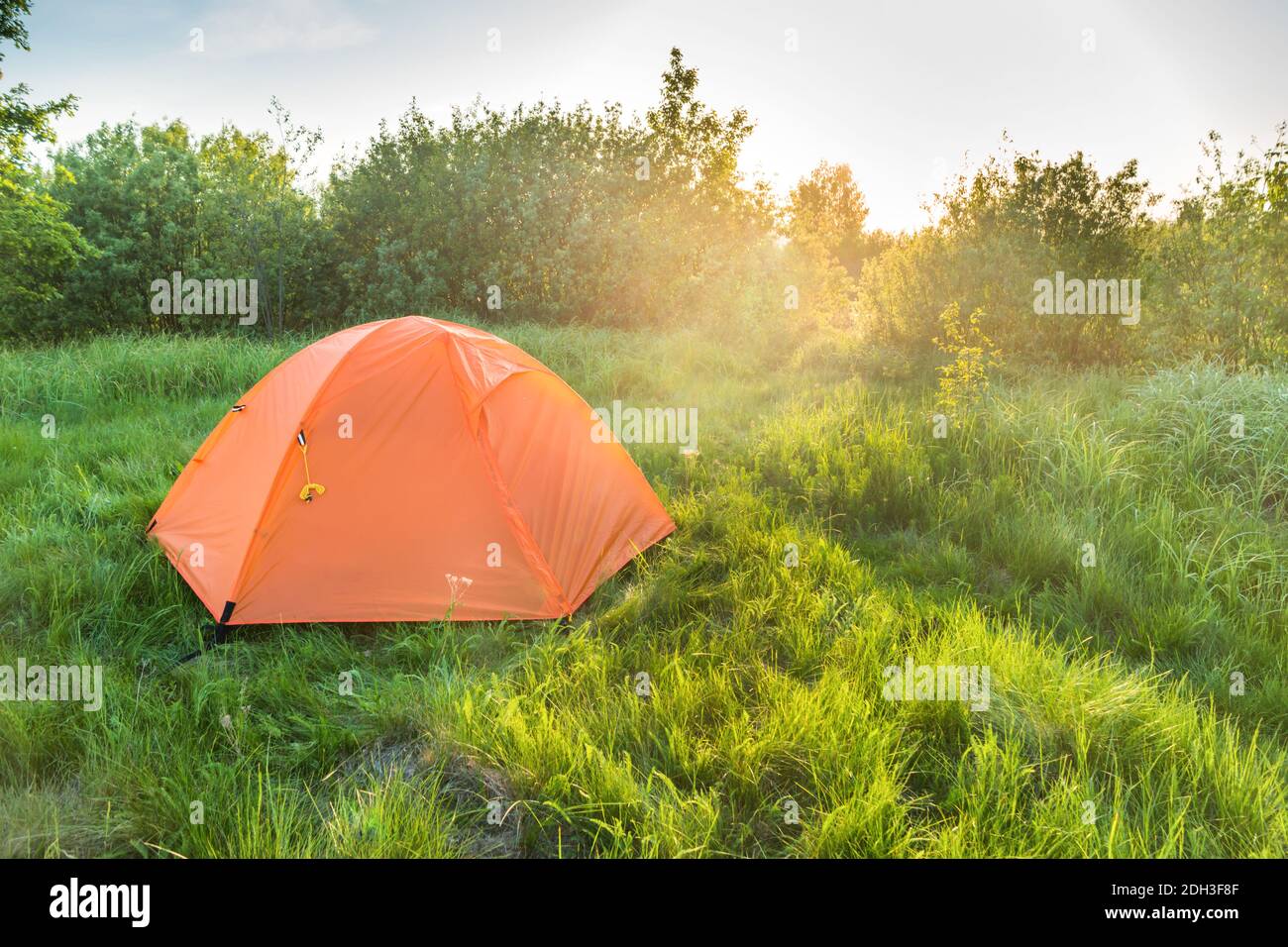 Tent camping at sunset Stock Photo - Alamy