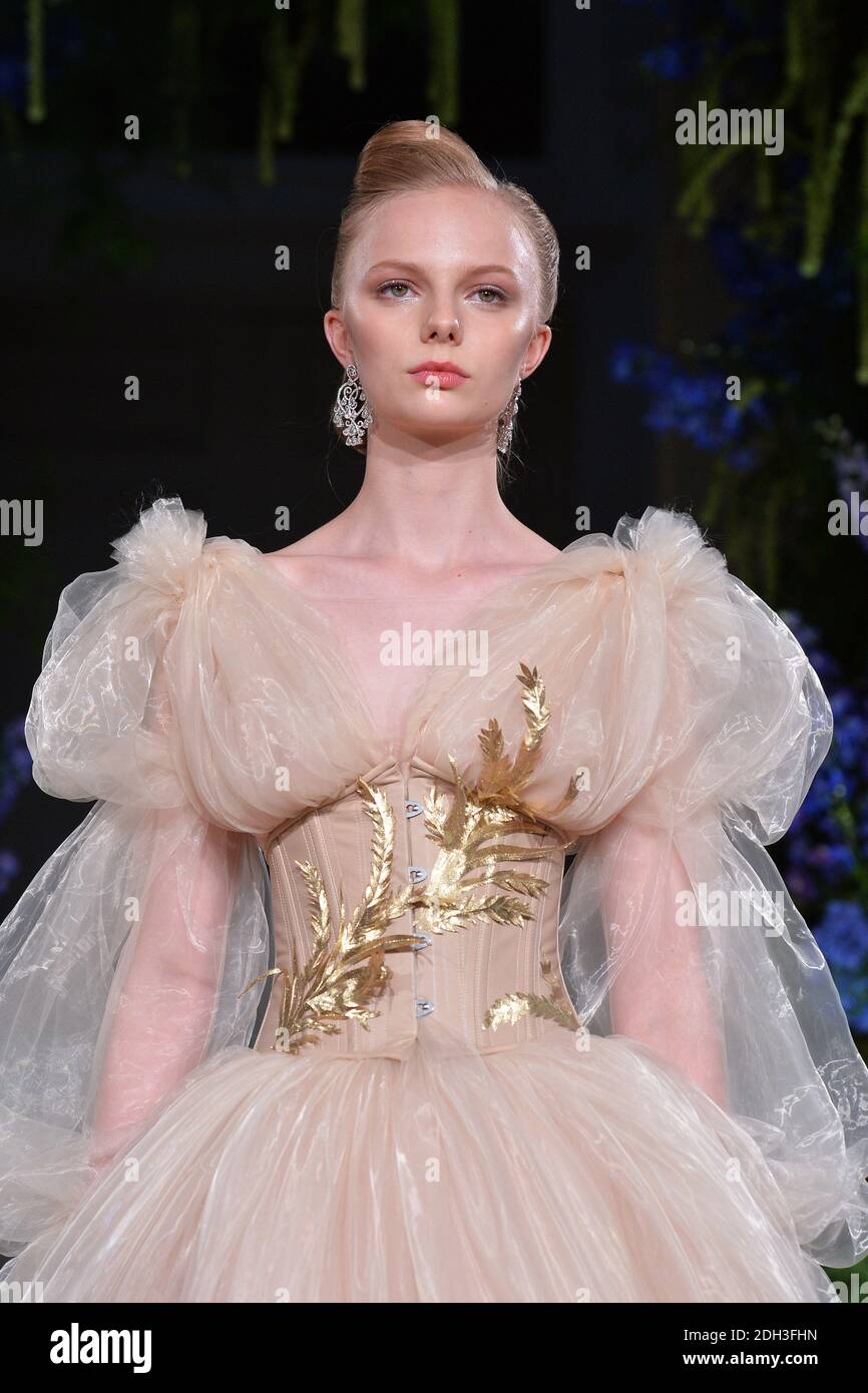 A model displays a creation designed by Guo Pei during the Guo Pei’s ...