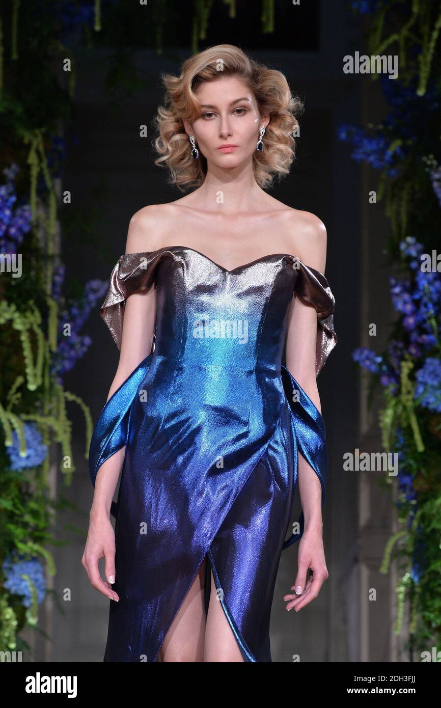 A model displays a creation designed by Guo Pei during the Guo Pei’s ...