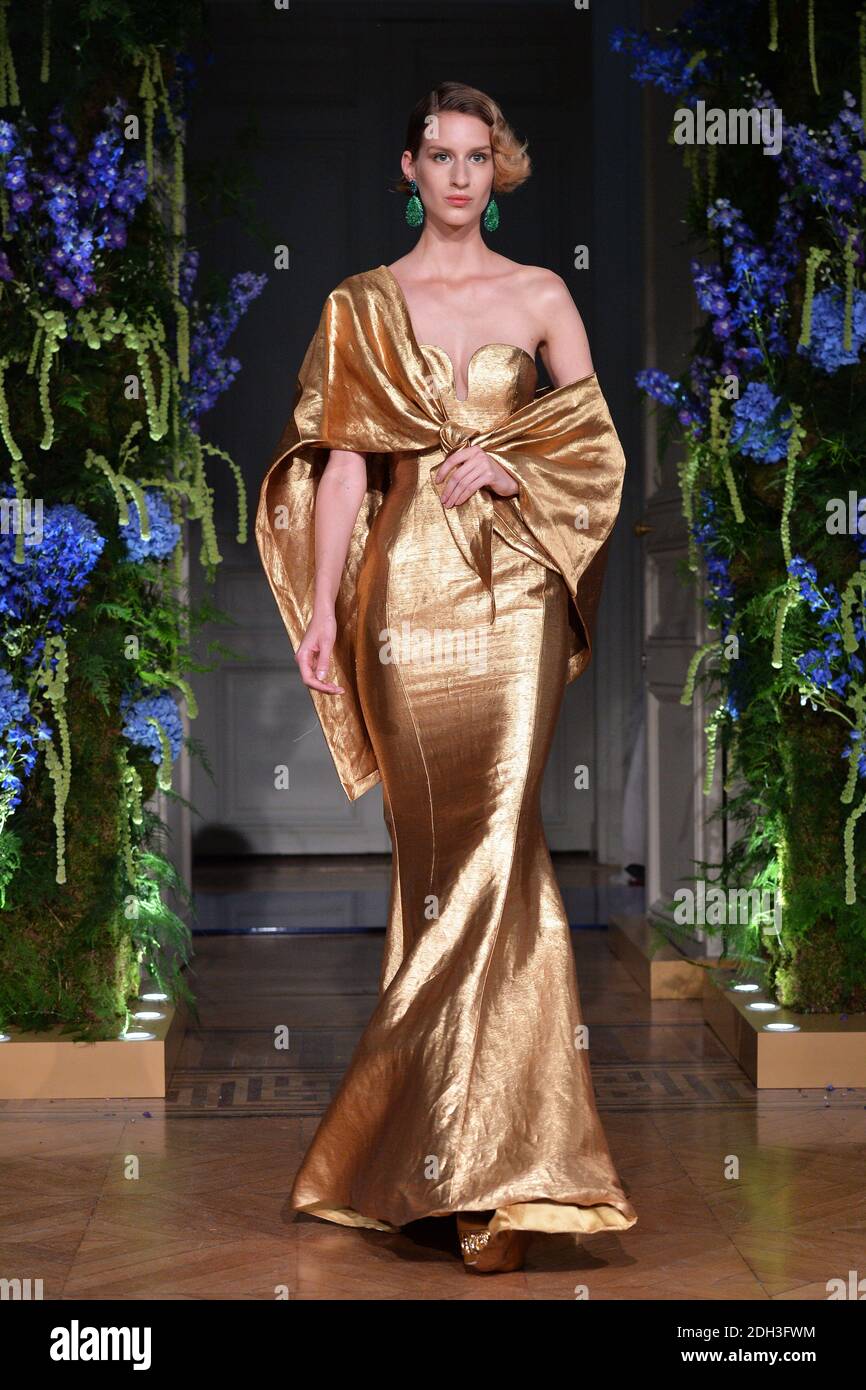 A model displays a creation designed by Guo Pei during the Guo Pei’s ...