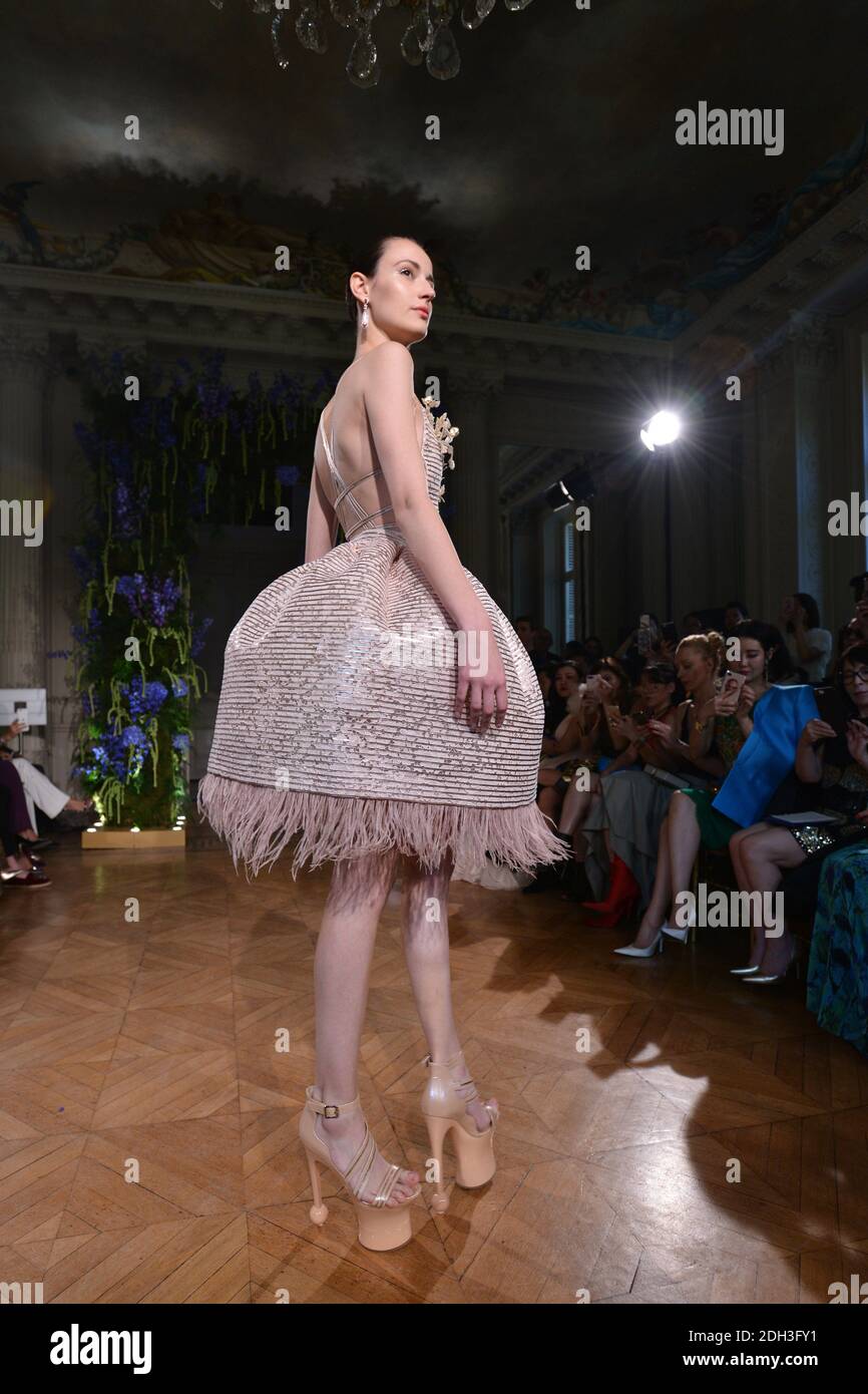 A model displays a creation designed by Guo Pei during the Guo Pei’s ...