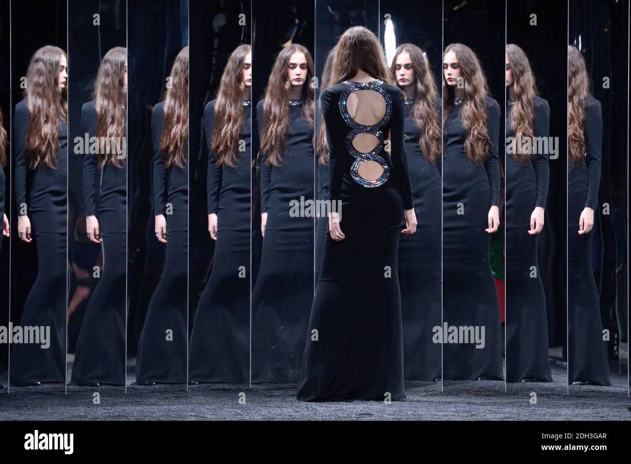 A model displays a creation on the runway during the Loris Azzaro 2017/ ...