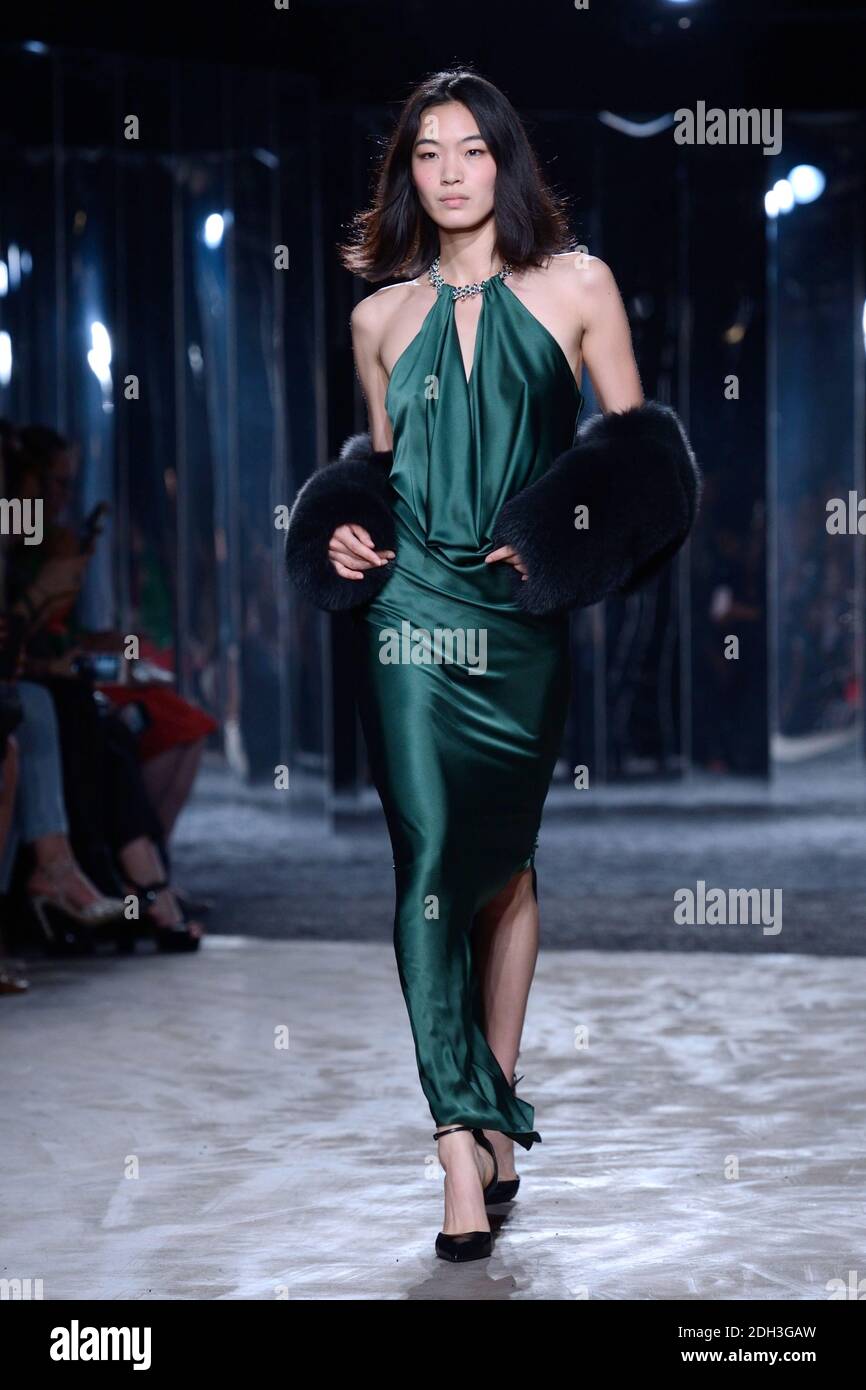 A model displays a creation on the runway during the Loris Azzaro 2017/ ...
