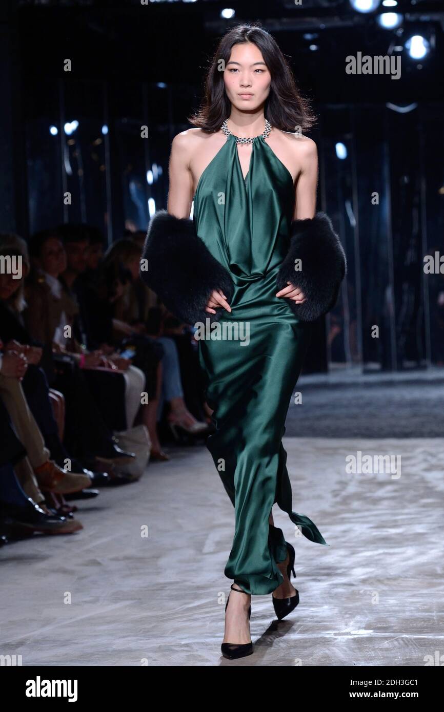 A model displays a creation on the runway during the Loris Azzaro 2017/ ...