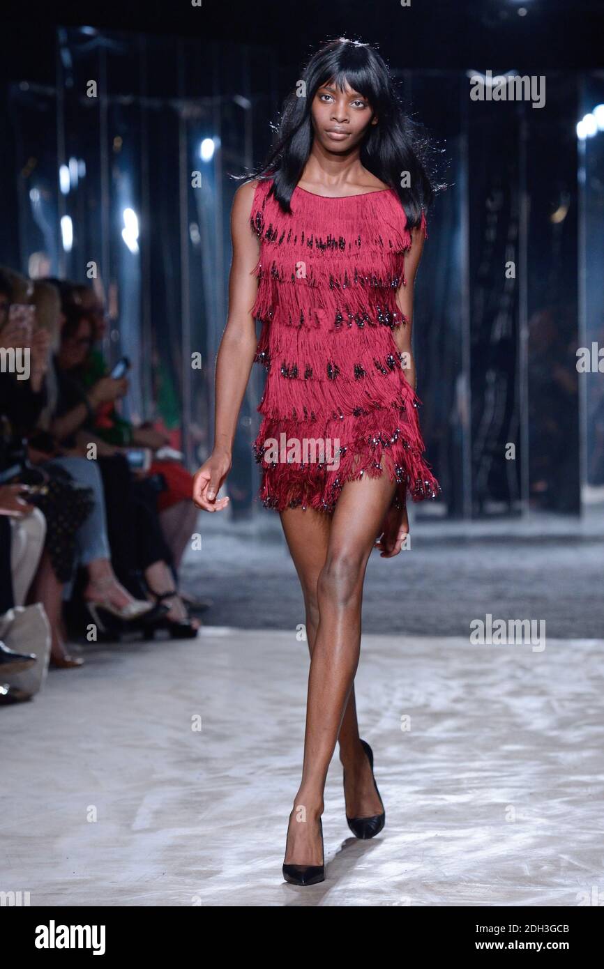 A model displays a creation on the runway during the Loris Azzaro 2017/ ...