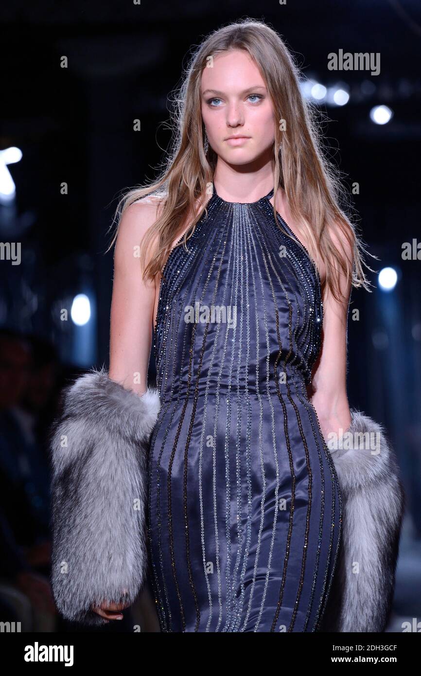 A model displays a creation on the runway during the Loris Azzaro 2017/ ...