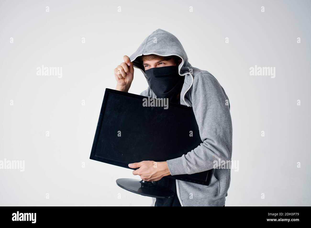 masked man with hood steals monitor technician hacker marking Stock ...