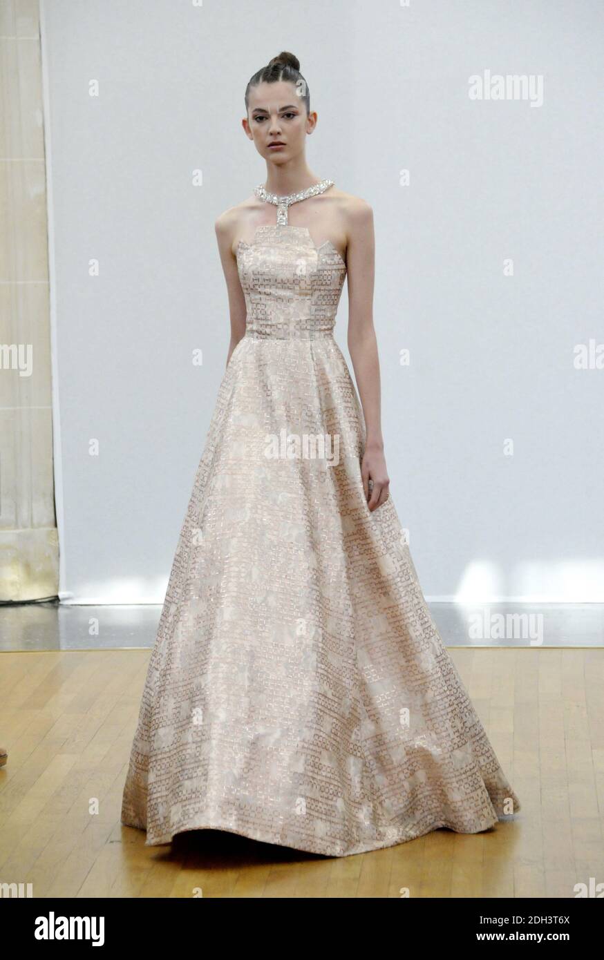 A model displays a creation designed by Gyunel Couture during the ...