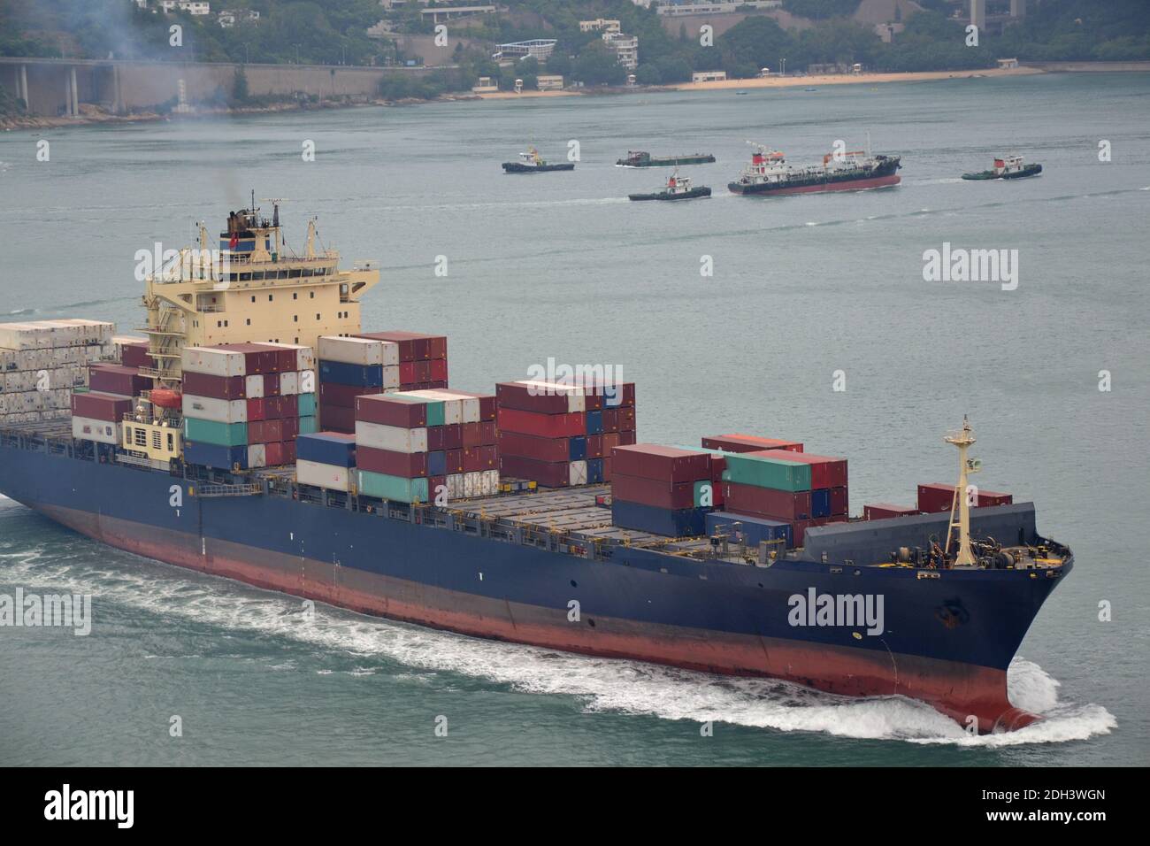 Large heavy blue and red container ship in harbor of Hong Kong Stock ...