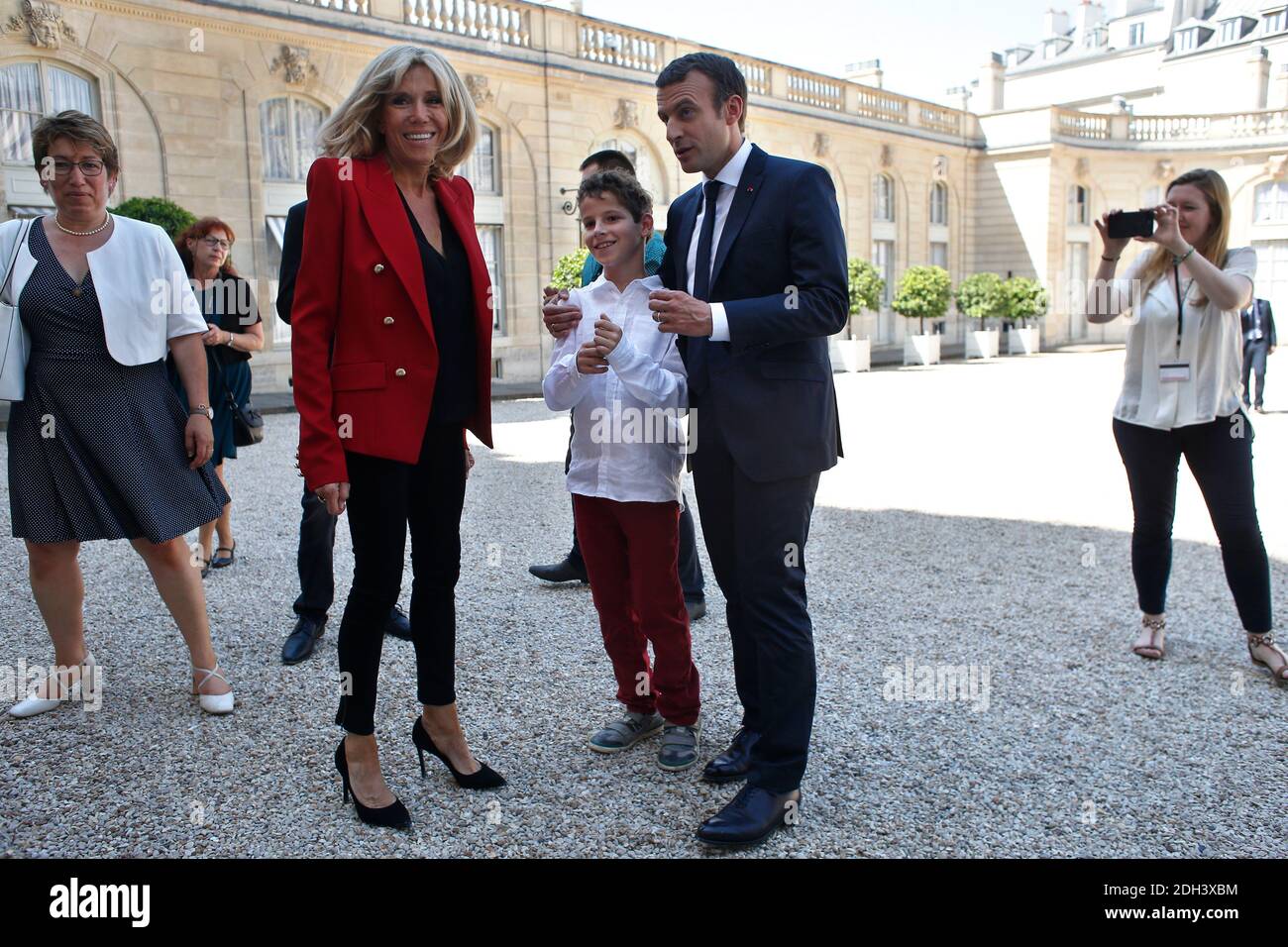 France's President Emmanuel Macron, center right, and his wife Brigitte ...