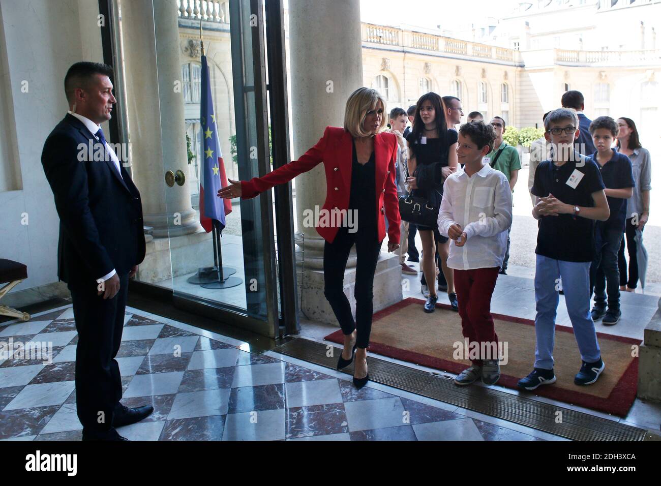Wife of France's President Emmanuel Macron, Brigitte Macron, welcomes ...