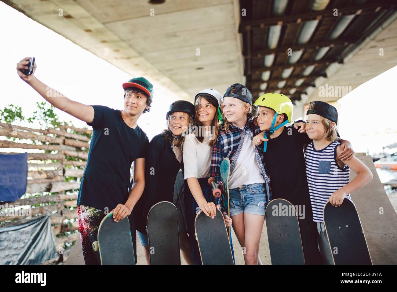 Large group friends children skateboarders make videos, online ...