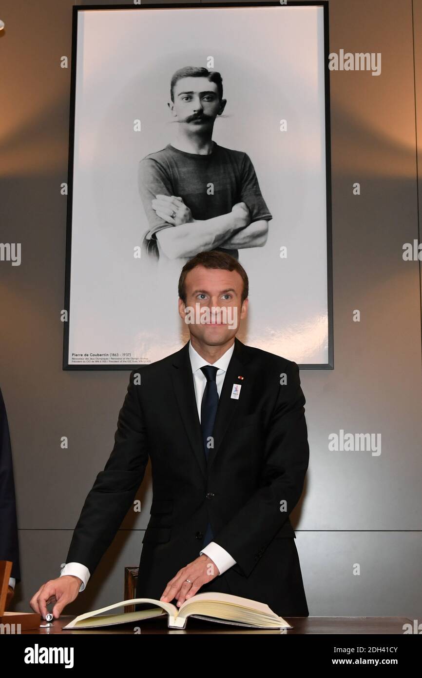 Handout photo - President of French Republic Emmanuel Macron signs the ...
