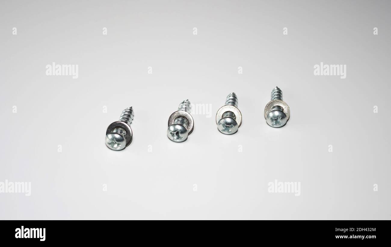 Silver screws. Self-tapping screws Stock Photo - Alamy