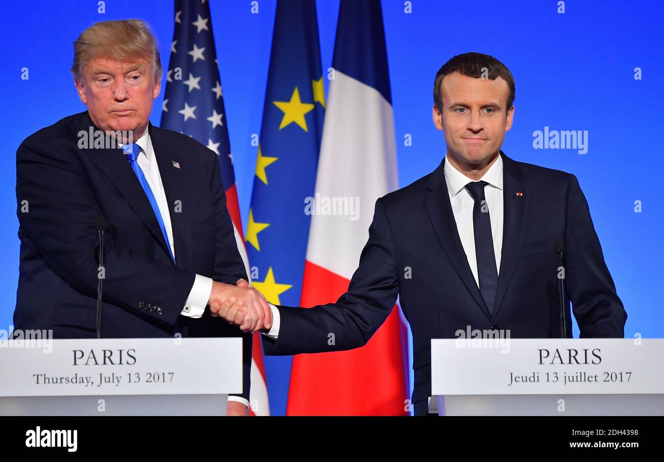 US president Donald Trump and French counterpart Emmanuel Macron hold a ...