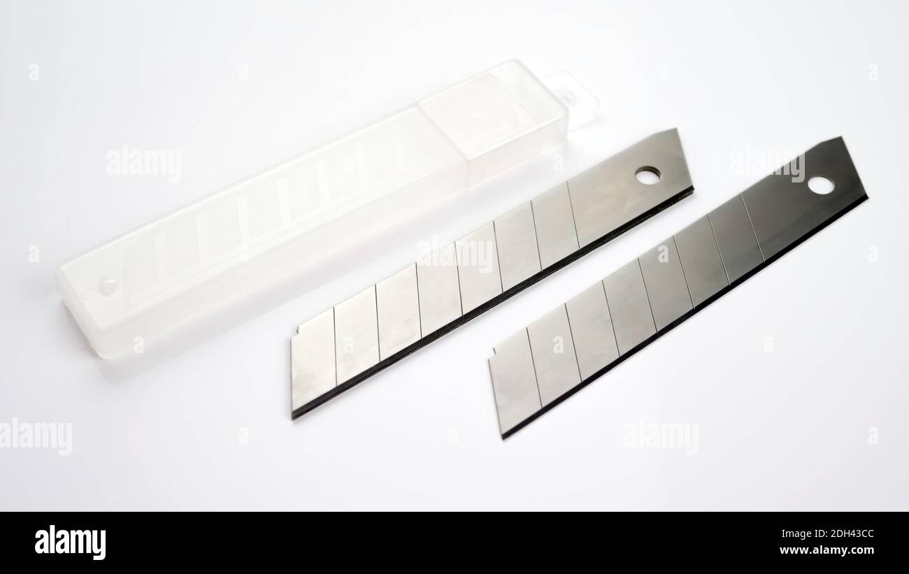 Construction blade.Complete with a plastic case.On a white background ...