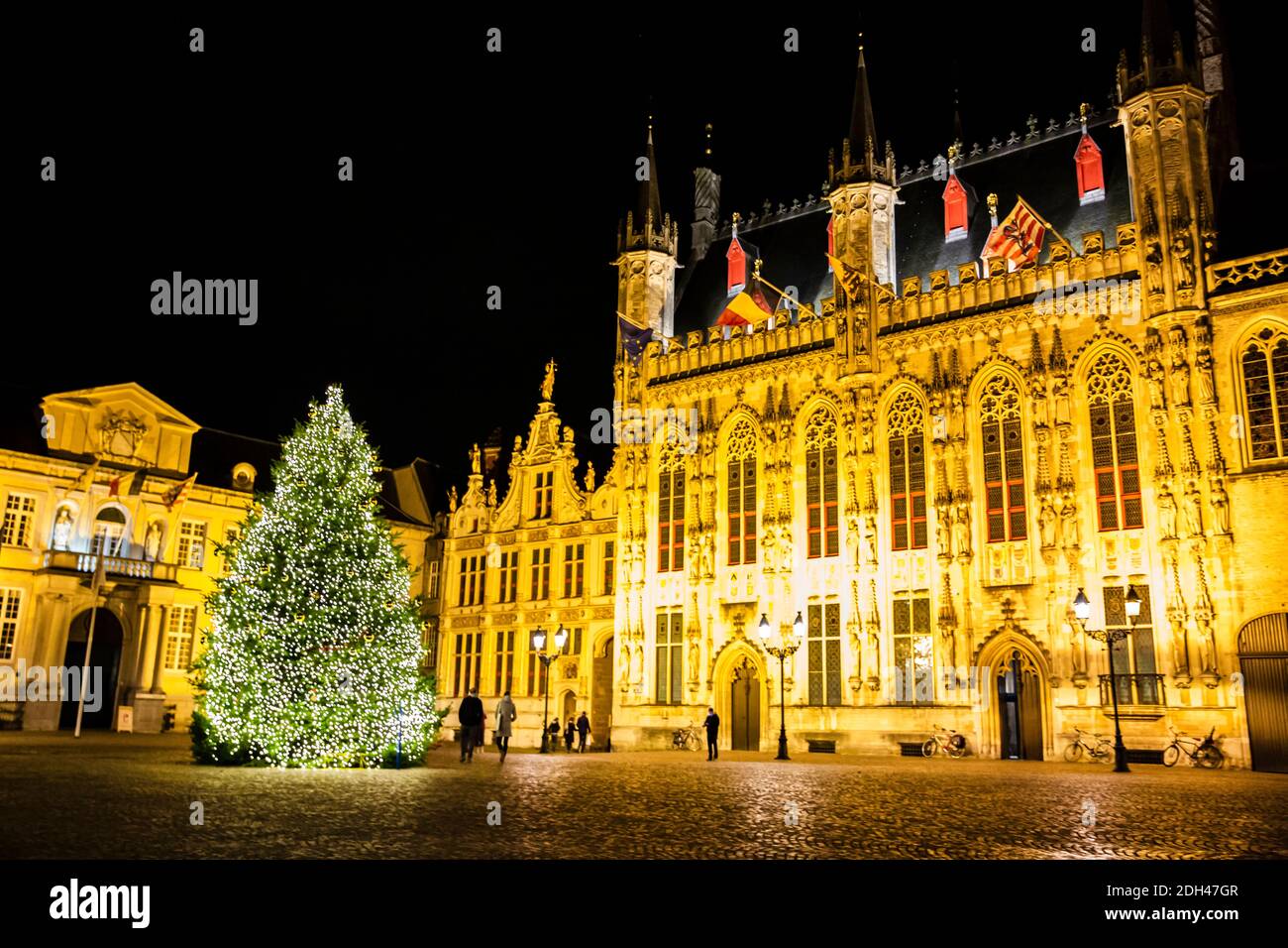 Christmas tree on Burg square and City Hall in Bruges, Belgium. Festive ...