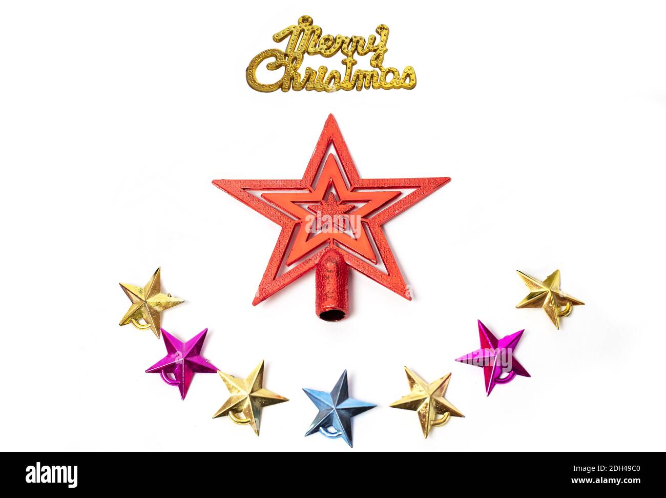 A top view of colorful Christmas star ornaments with a message of Merry ...